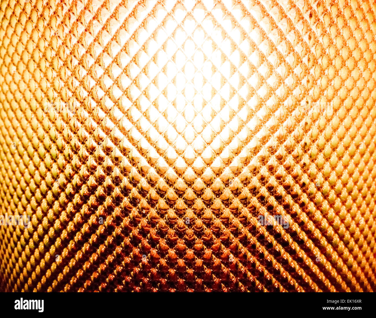 Yellow textured back lighted of glass lamp cover Stock Photo - Alamy