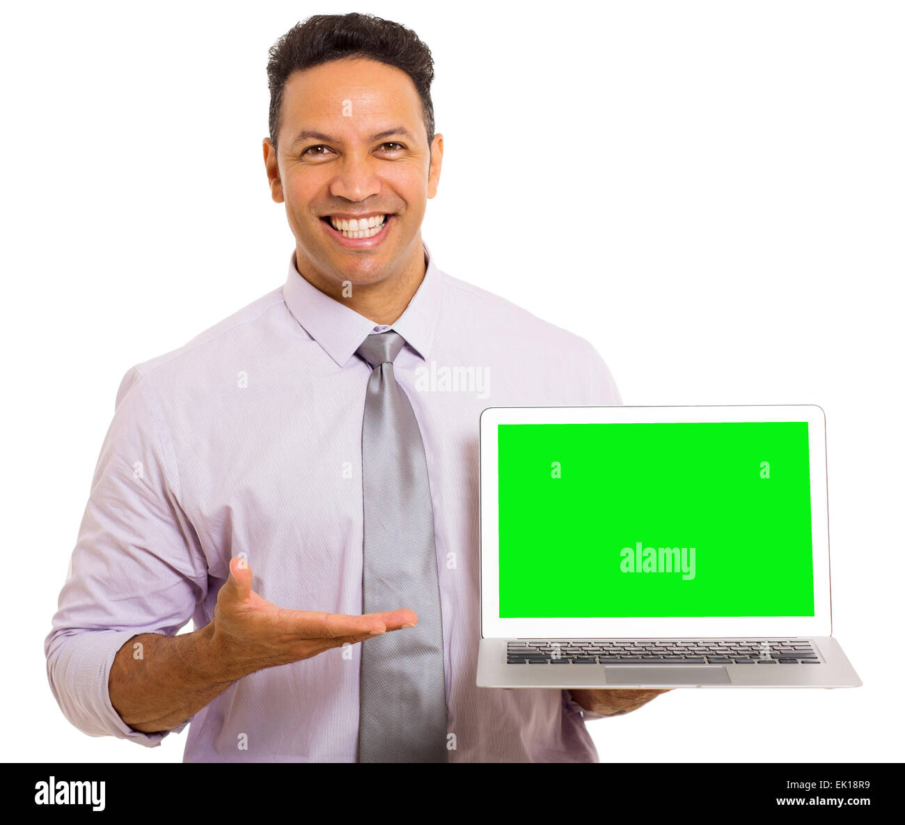 cheerful mid age businessman presenting laptop computer on white ...