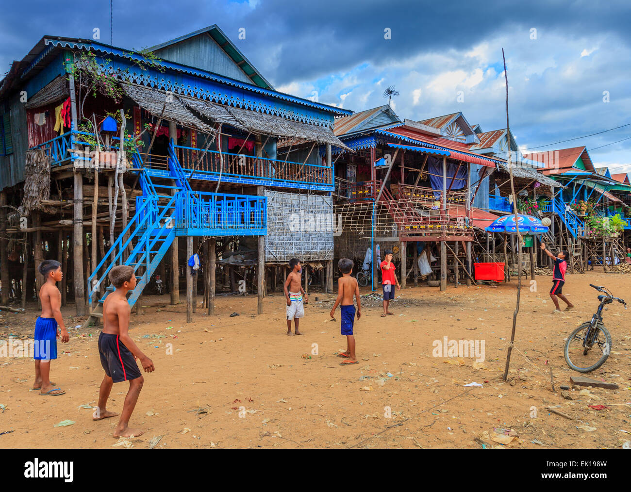 Boys playing volleyball at Kampong Phulk floating village Stock Photo ...
