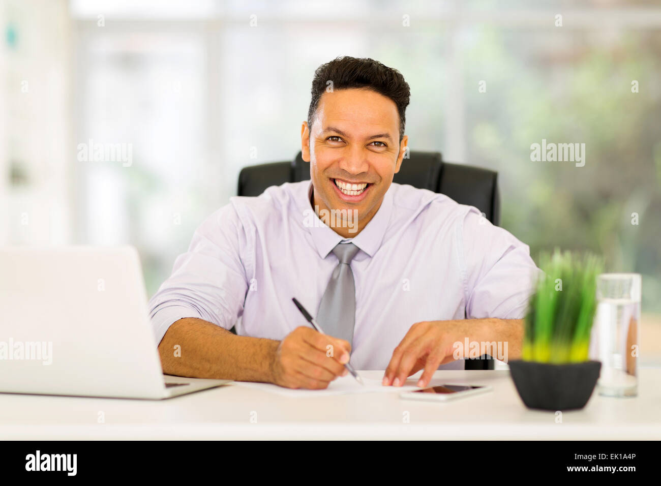 good looking mid age business executive working in office Stock Photo ...