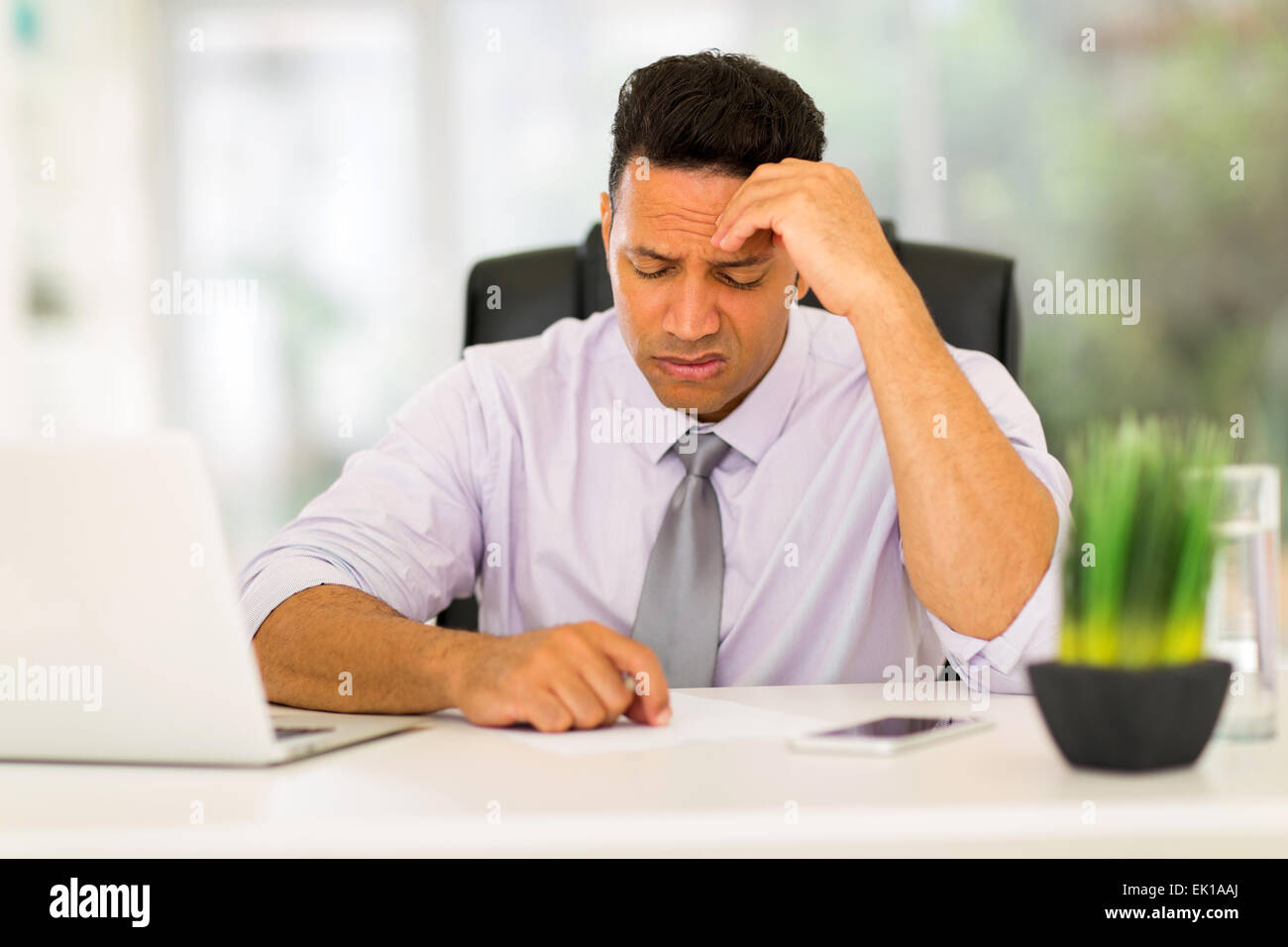 stressed businessman having headache at work Stock Photo - Alamy
