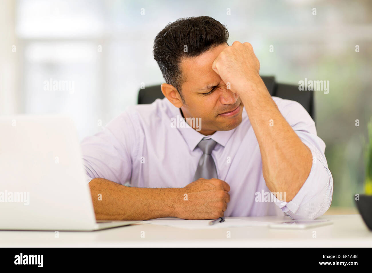 stressed middle aged businessman sitting in office Stock Photo - Alamy