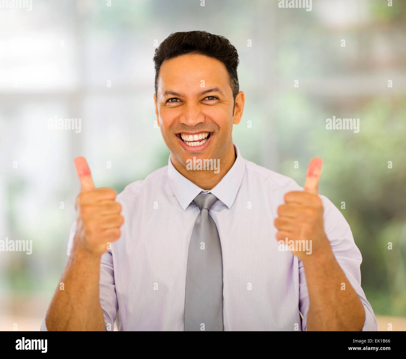 Happy office worker thumbs up hi-res stock photography and images - Alamy
