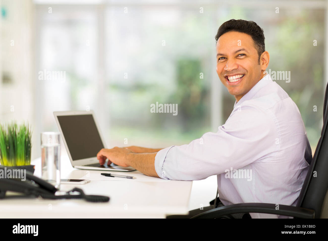 successful business man using computer in office Stock Photo - Alamy