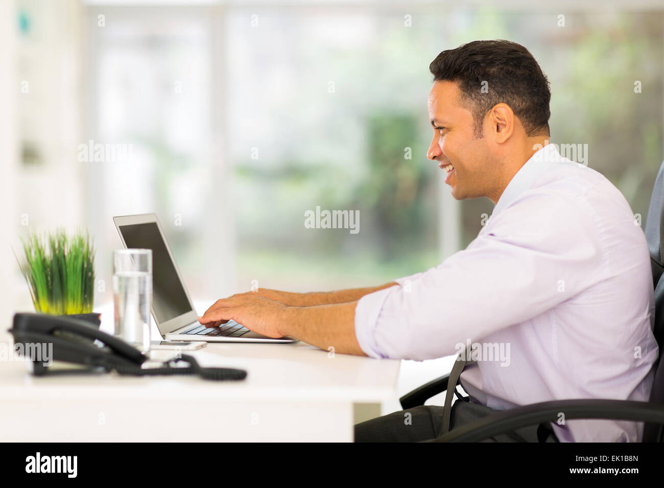 professional middle aged entrepreneur working on laptop computer Stock ...