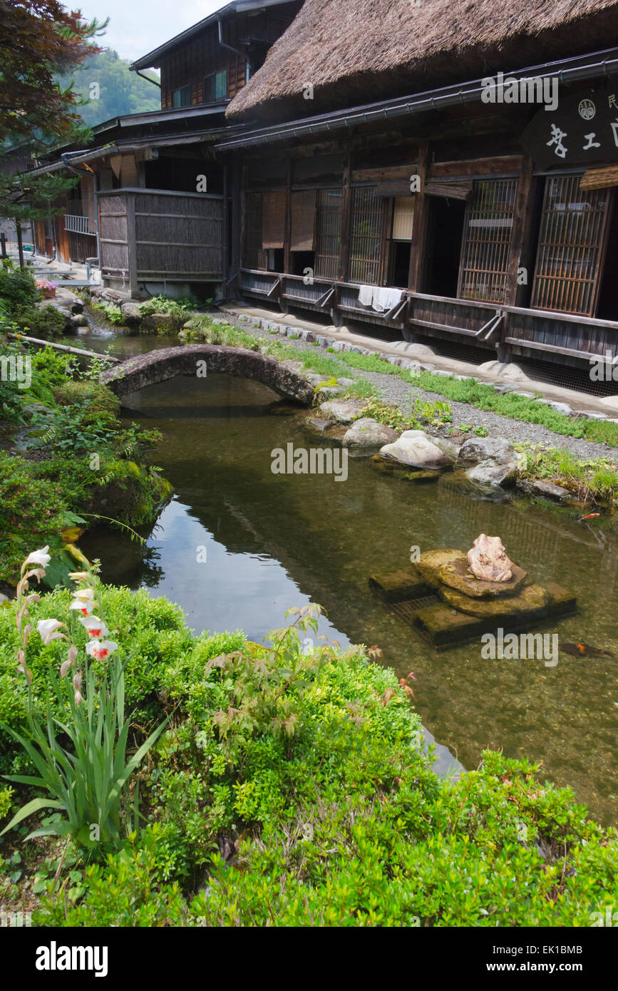 Gassho-zukuri house and stone bridge in the mountain, Shirakawa-go ...