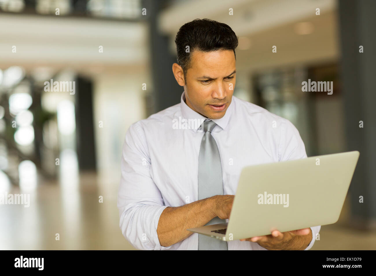 successful entrepreneur working on laptop computer Stock Photo - Alamy