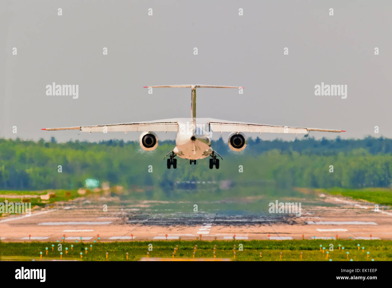 Rear view of an aircraft departing from the airport Stock Photo - Alamy