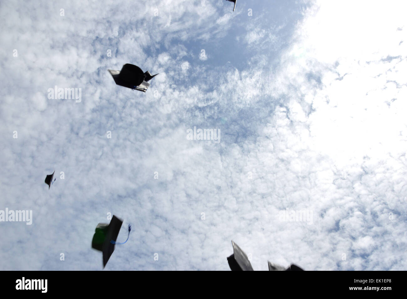 graduates hat thrown into the sky Stock Photo - Alamy