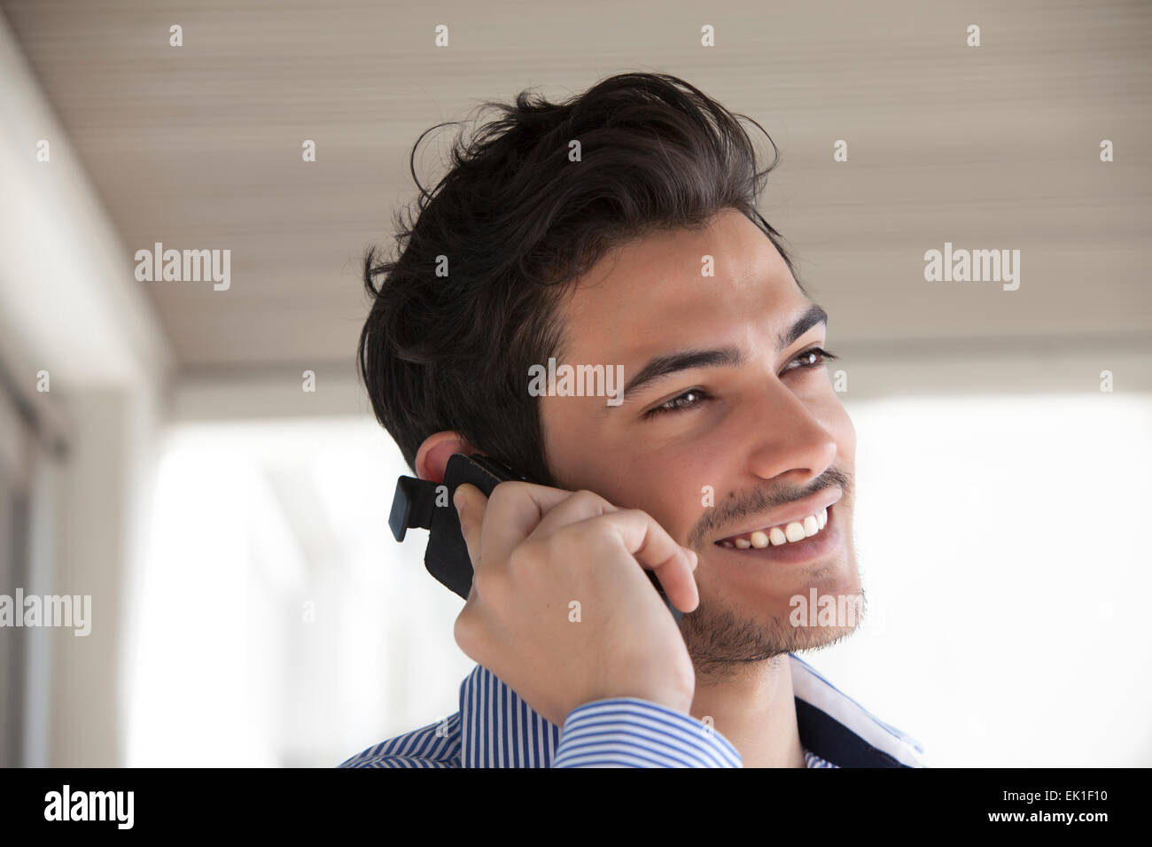 Young man using smart phone Stock Photo - Alamy