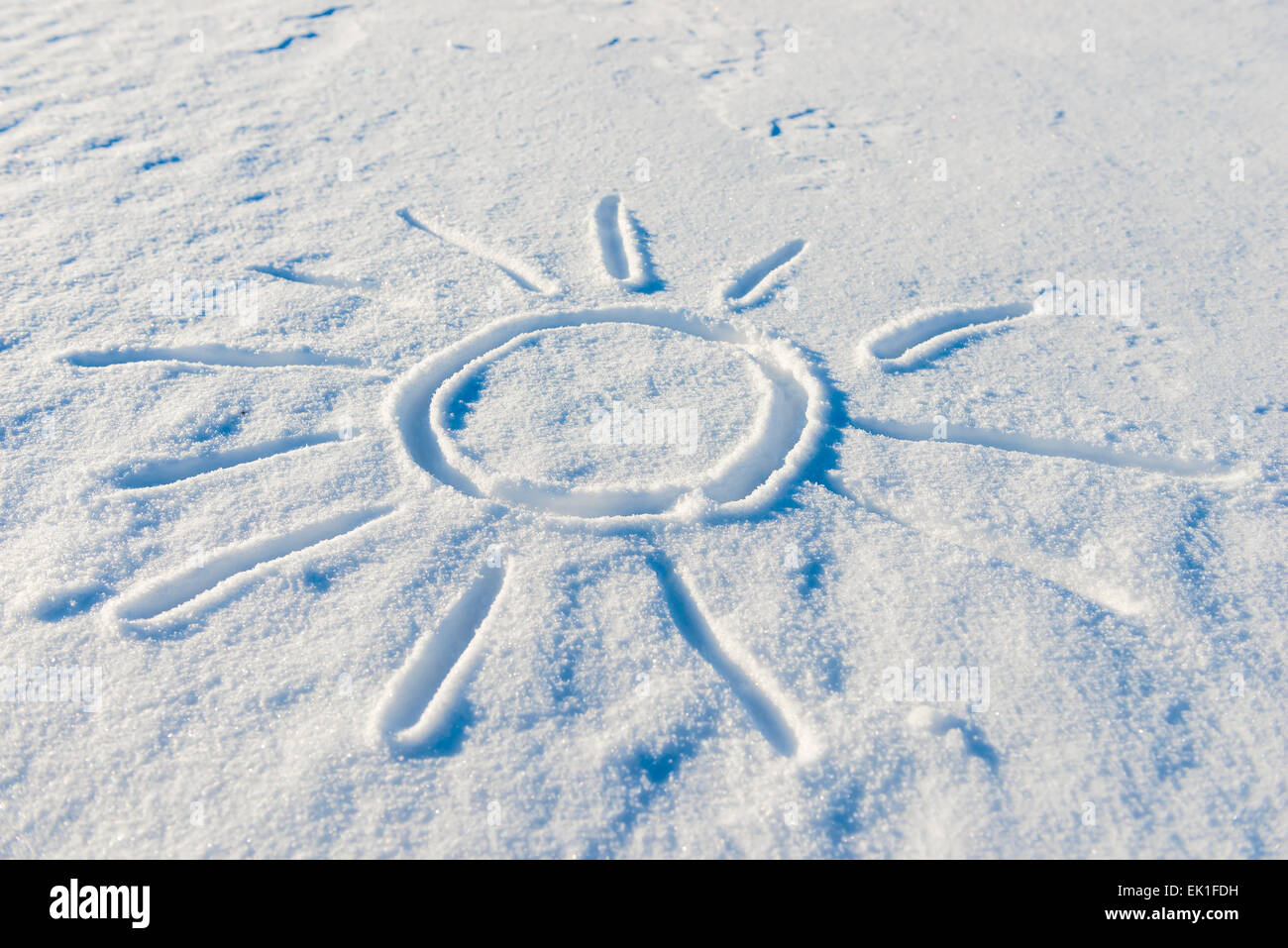 drawn sun on snow outdoors Stock Photo - Alamy