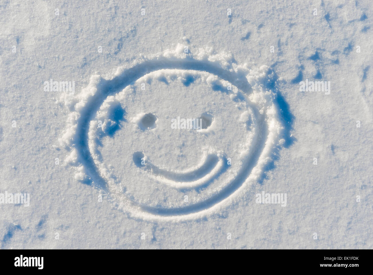 Smiley face drawn on snow hi-res stock photography and images - Alamy