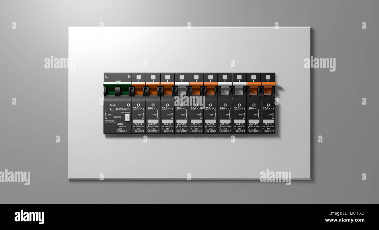 A row of switched on household electrical circuit breakers on a wall ...