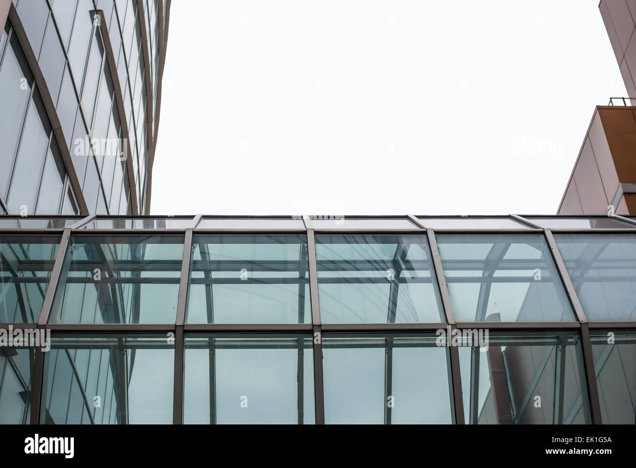 Glass gallery between buildings Stock Photo - Alamy