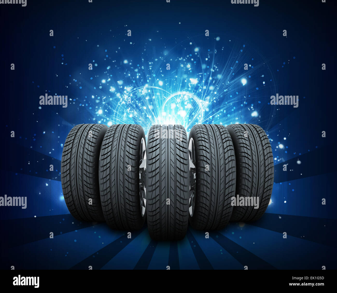 Wedge of new car wheels. Abstract blue background Stock Photo - Alamy