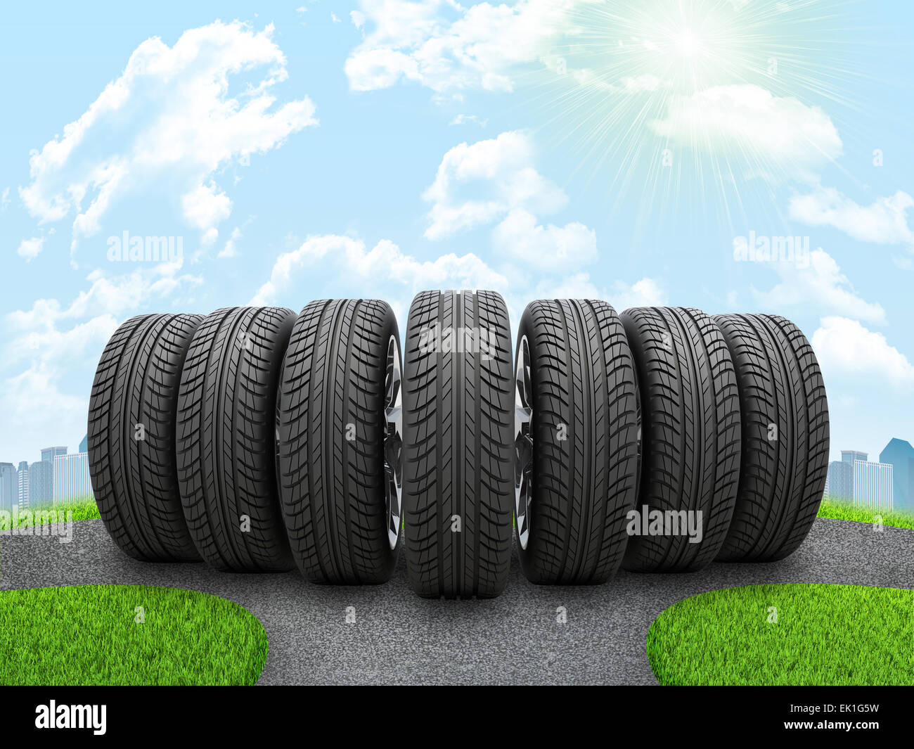 Wedge of new car wheels on road fork Stock Photo - Alamy