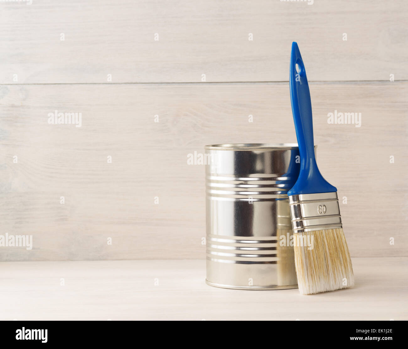 paint bucket and paintbrush on wooden background Stock Photo - Alamy