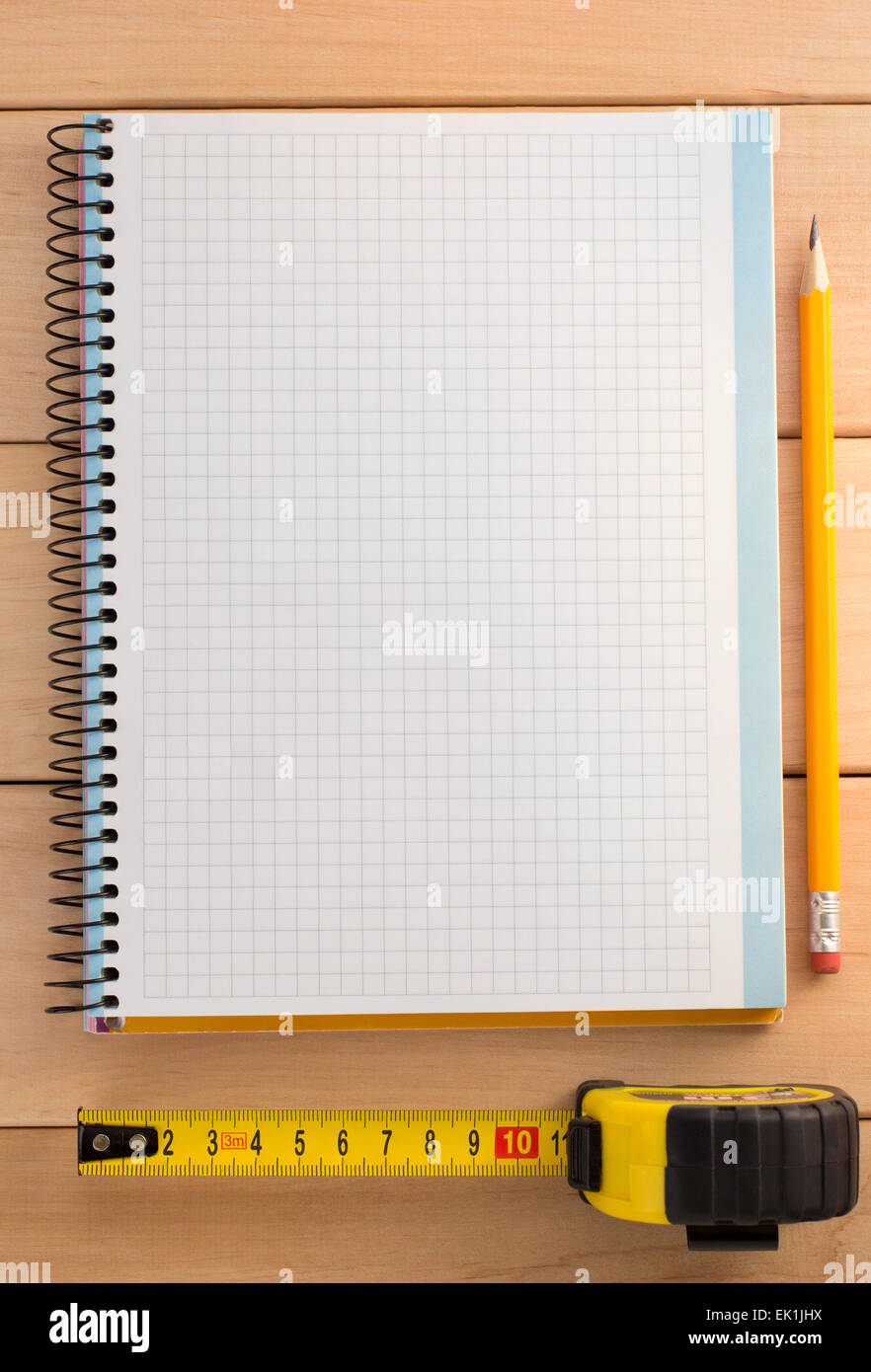 tape measure and pencil on wooden texture Stock Photo - Alamy