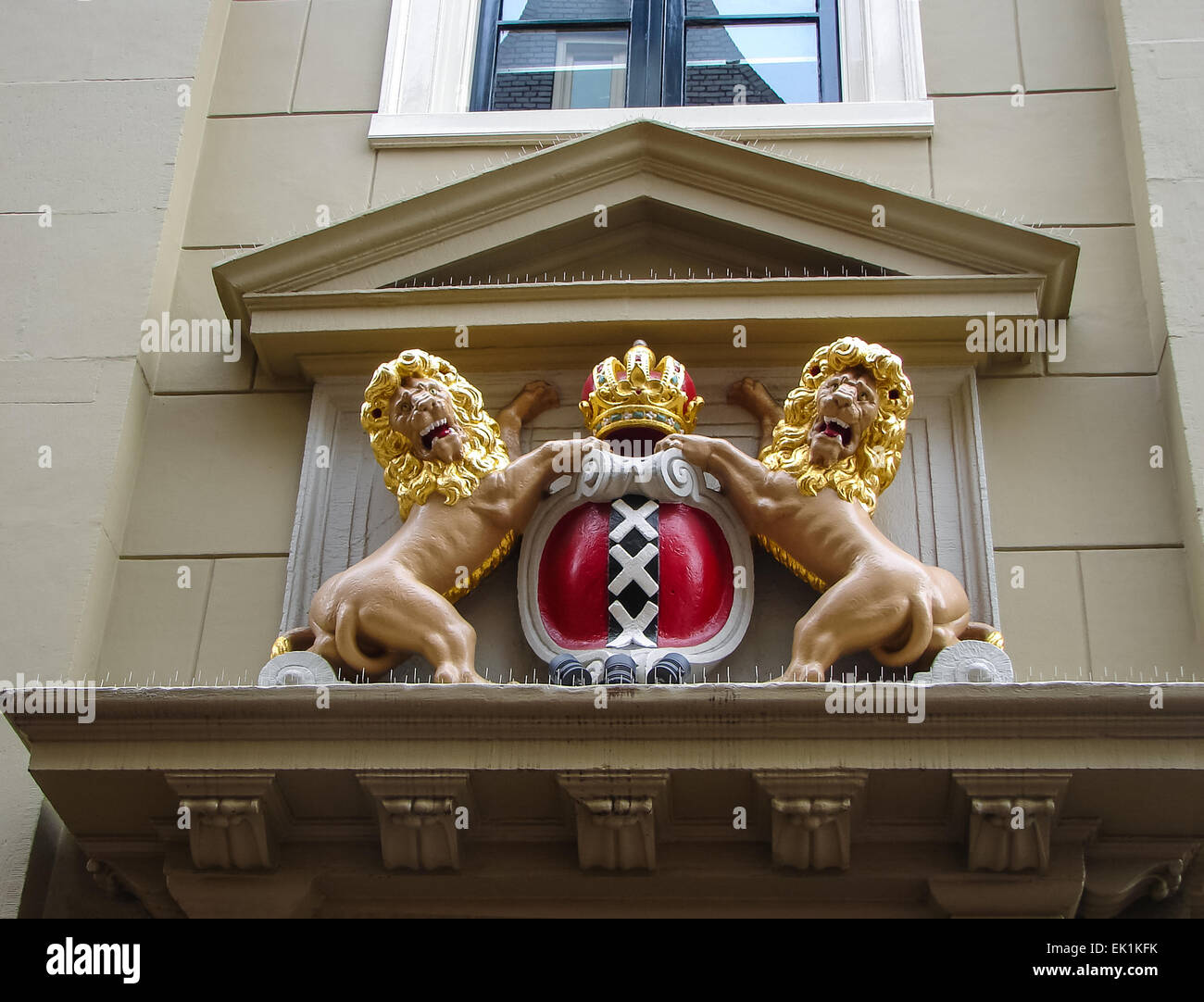 Amsterdam coat of arms on the facade of the city building. Netherlands ...