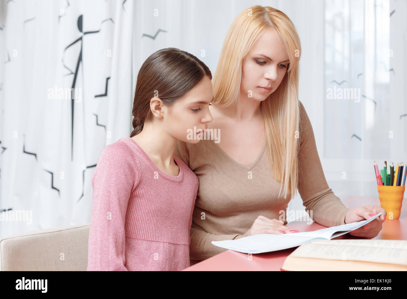 Mother and daughter study together Stock Photo - Alamy