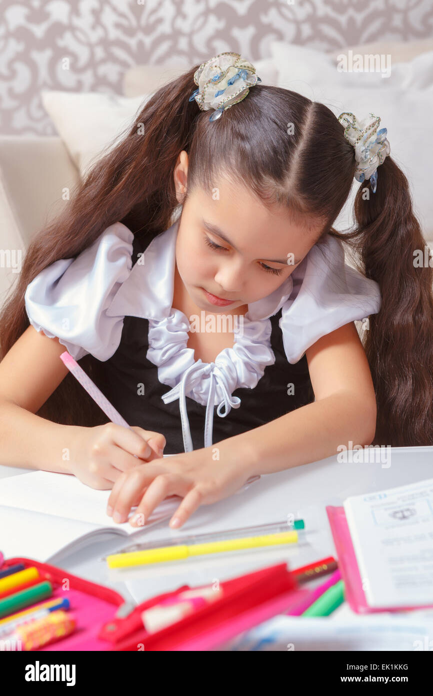 School girl doing writing Stock Photo - Alamy