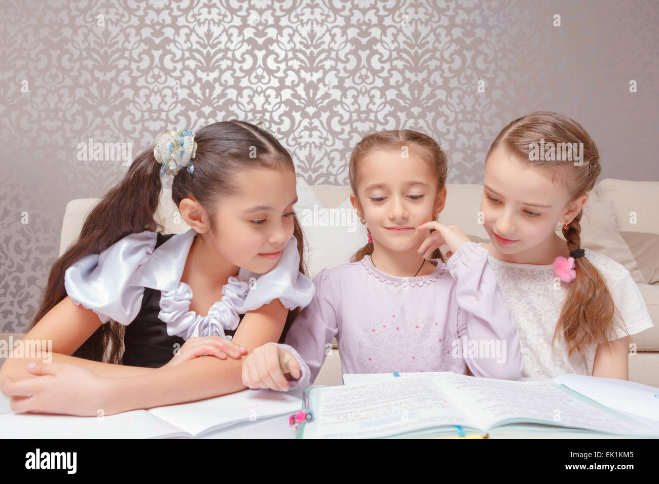 Small girls studying together Stock Photo - Alamy
