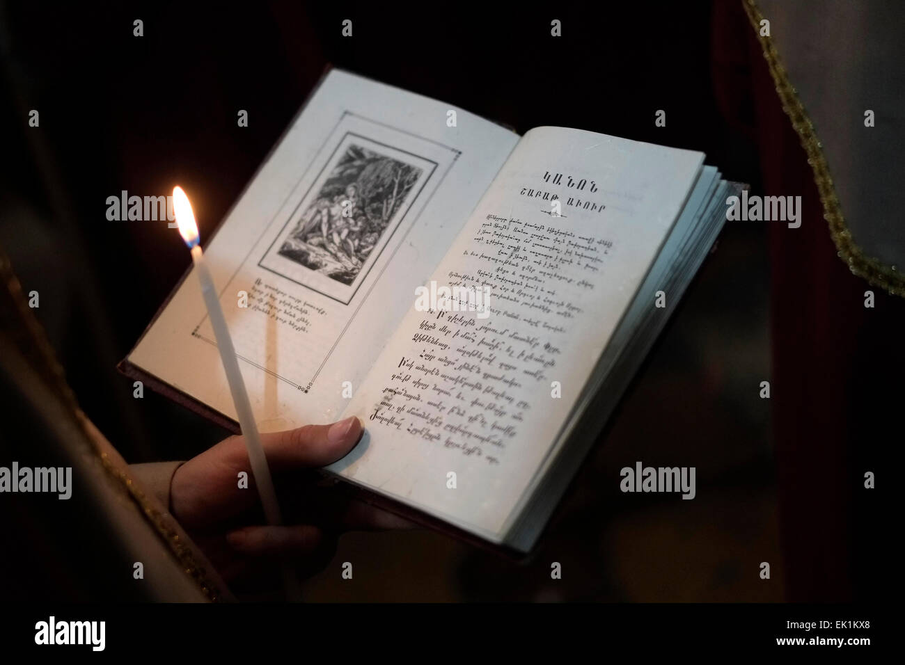 An Armenian Apostolic cleric reading a sacred script in Armenian ...