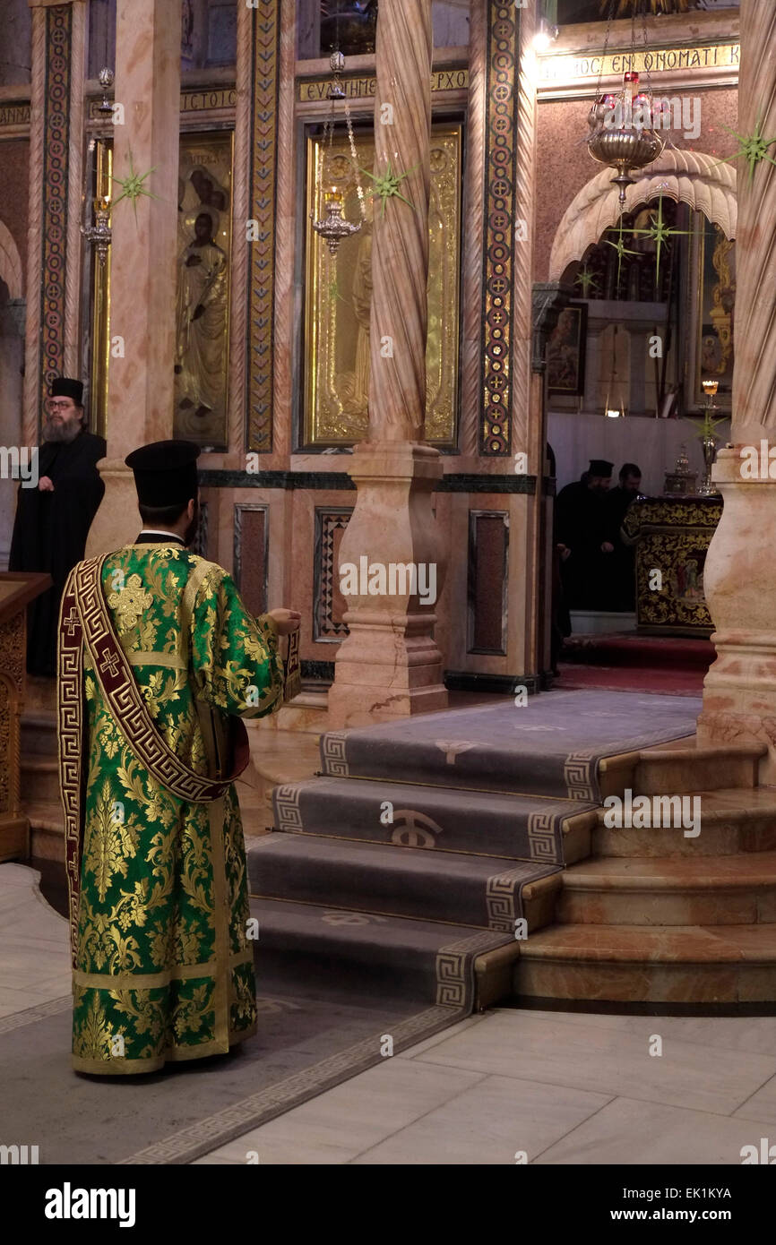 Greek Orthodox priests taking part in a daily procession during Holy ...