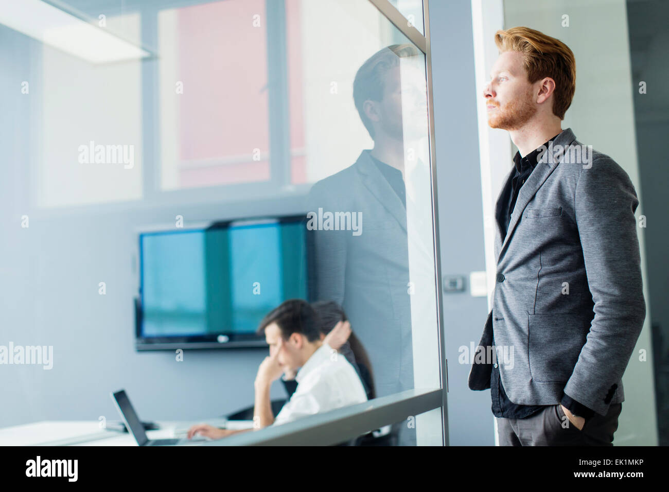 Young man in the office Stock Photo - Alamy