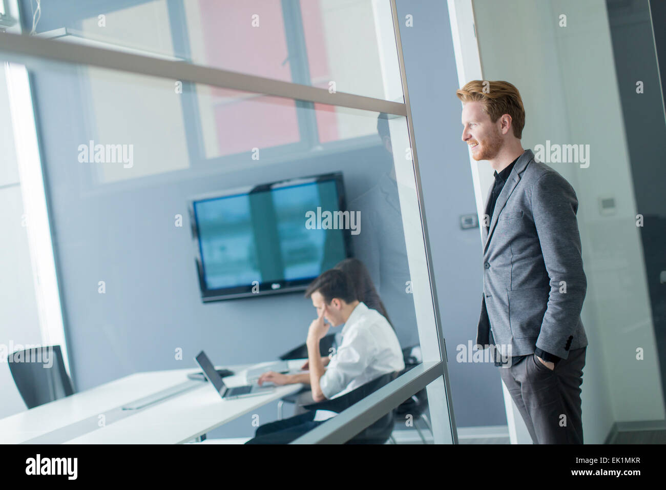 Young man in the office Stock Photo - Alamy