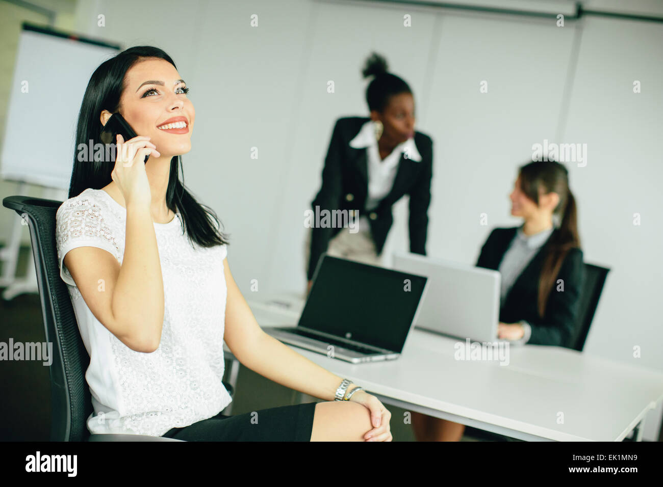 Young women working in the office Stock Photo - Alamy
