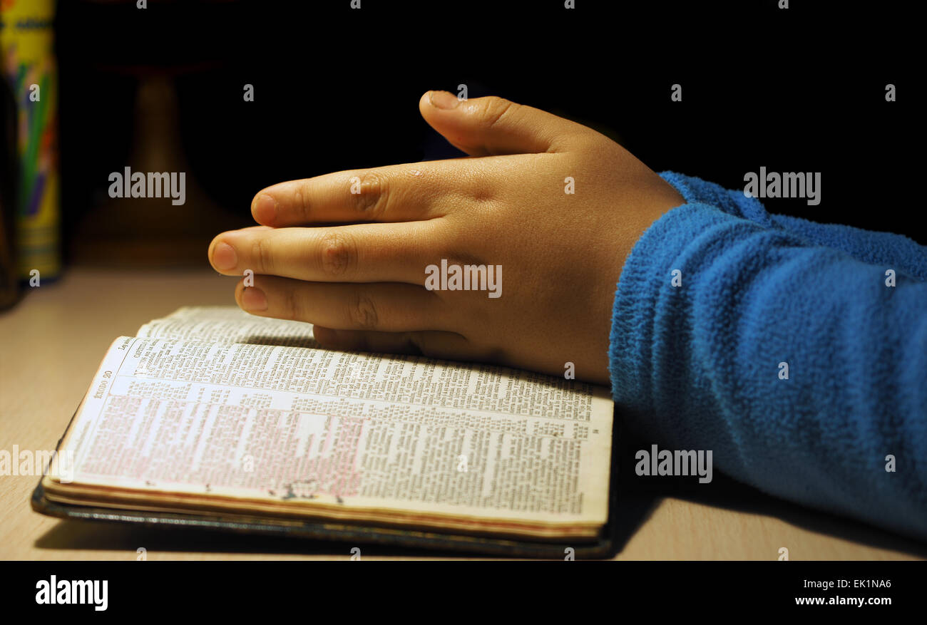 The hands of a child prayer Stock Photo - Alamy