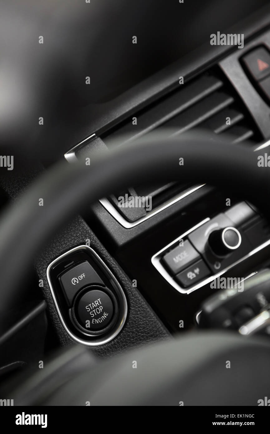 Detail on a black start button in a car Stock Photo - Alamy