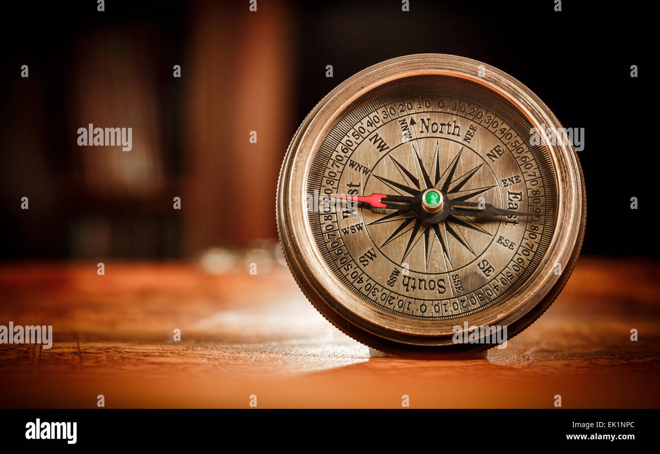 Vintage still life. Vintage compass lies on an ancient world map Stock ...
