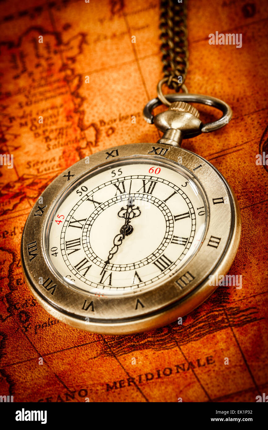 Vintage Antique pocket watch on an ancient world map in 1565 Stock ...