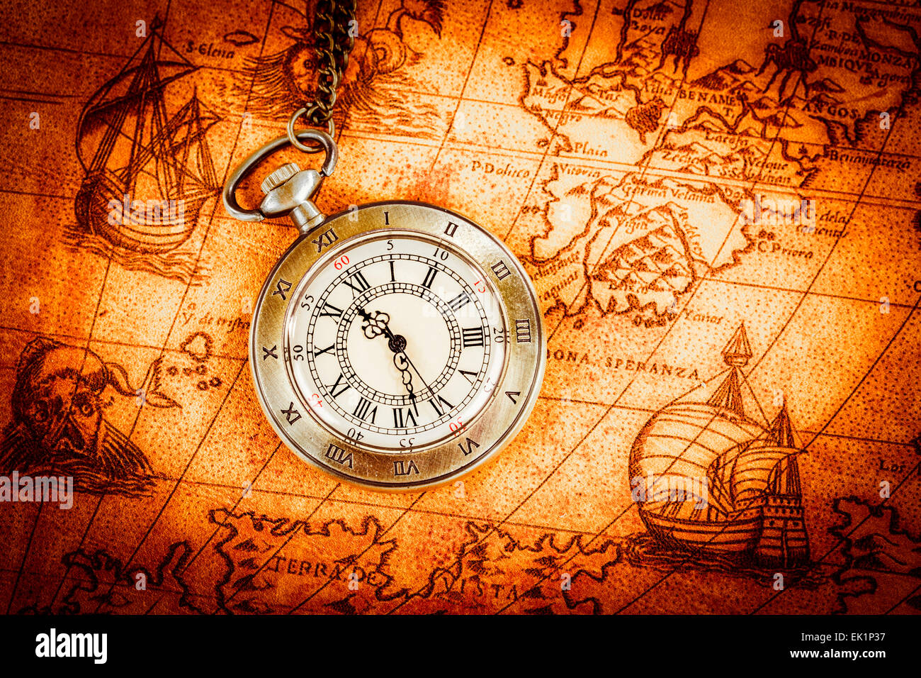 Vintage Antique pocket watch on an ancient world map in 1565 Stock ...