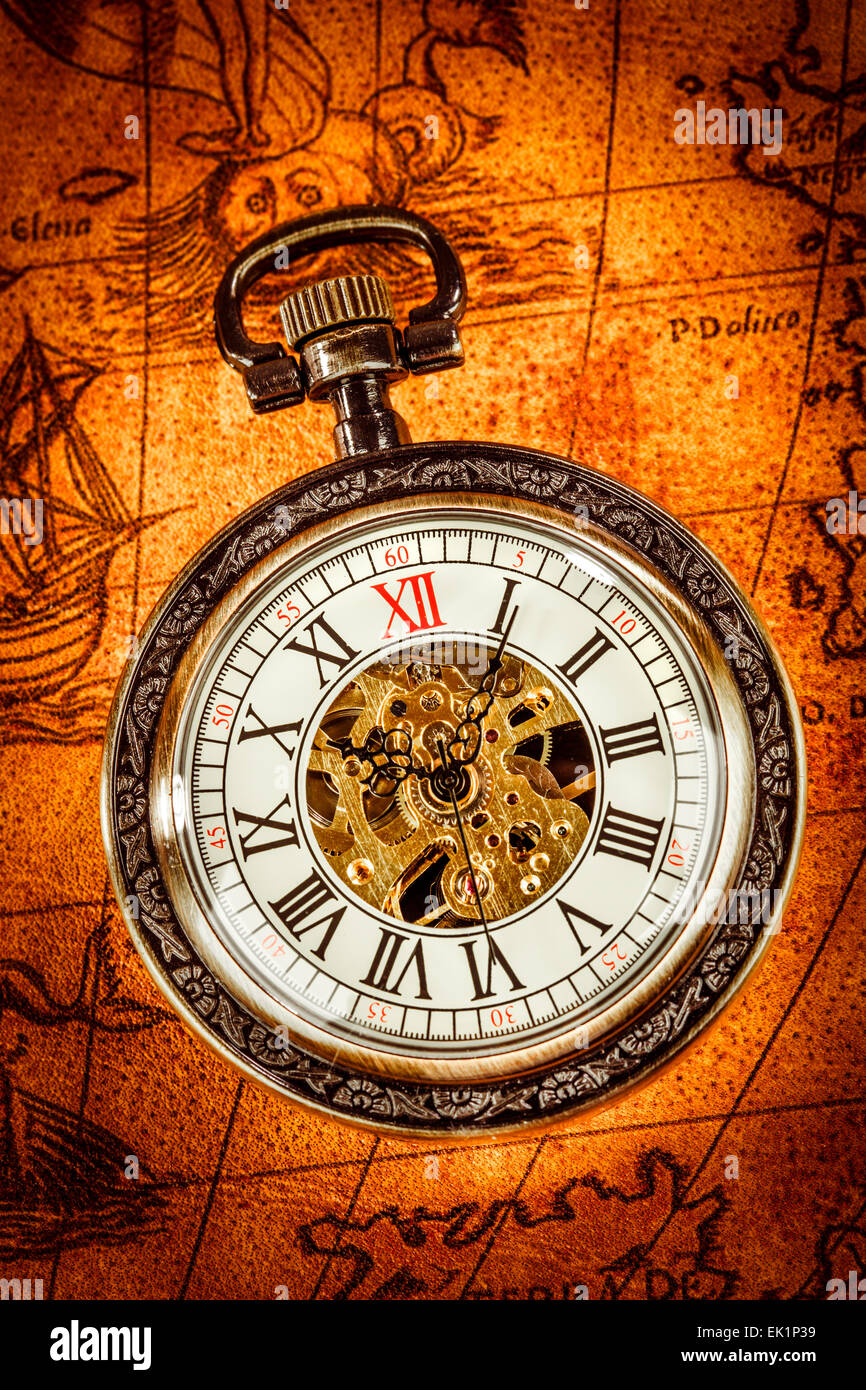 Vintage Antique pocket watch on an ancient world map in 1565 Stock ...