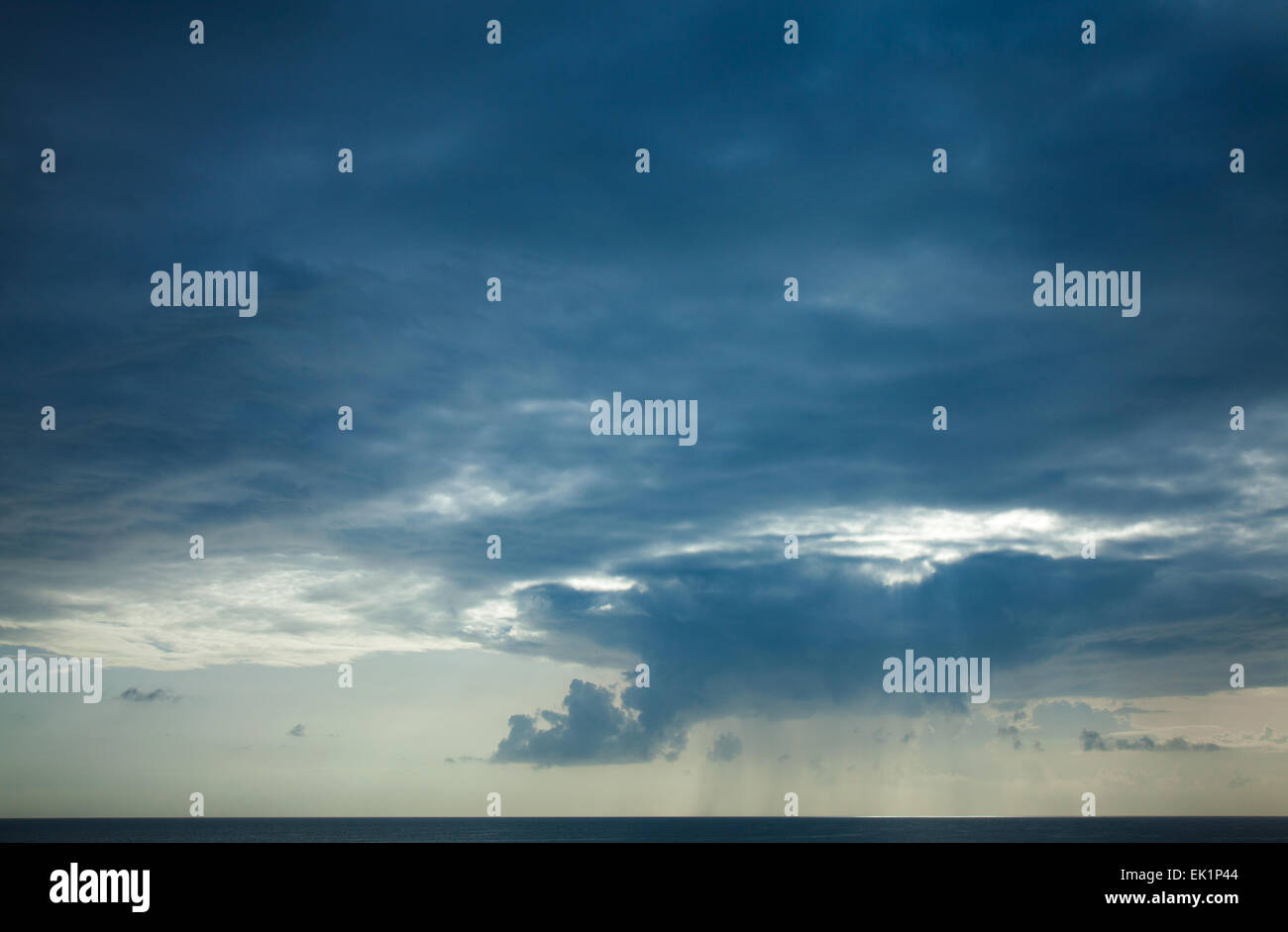 rain over ocean - natural cloudscape background Stock Photo - Alamy