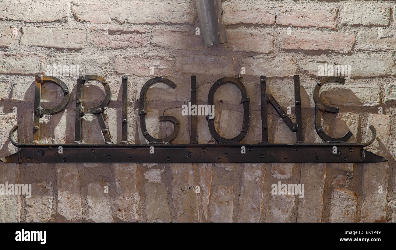 Written prison made with the metal in the middle ages on a brick wall ...
