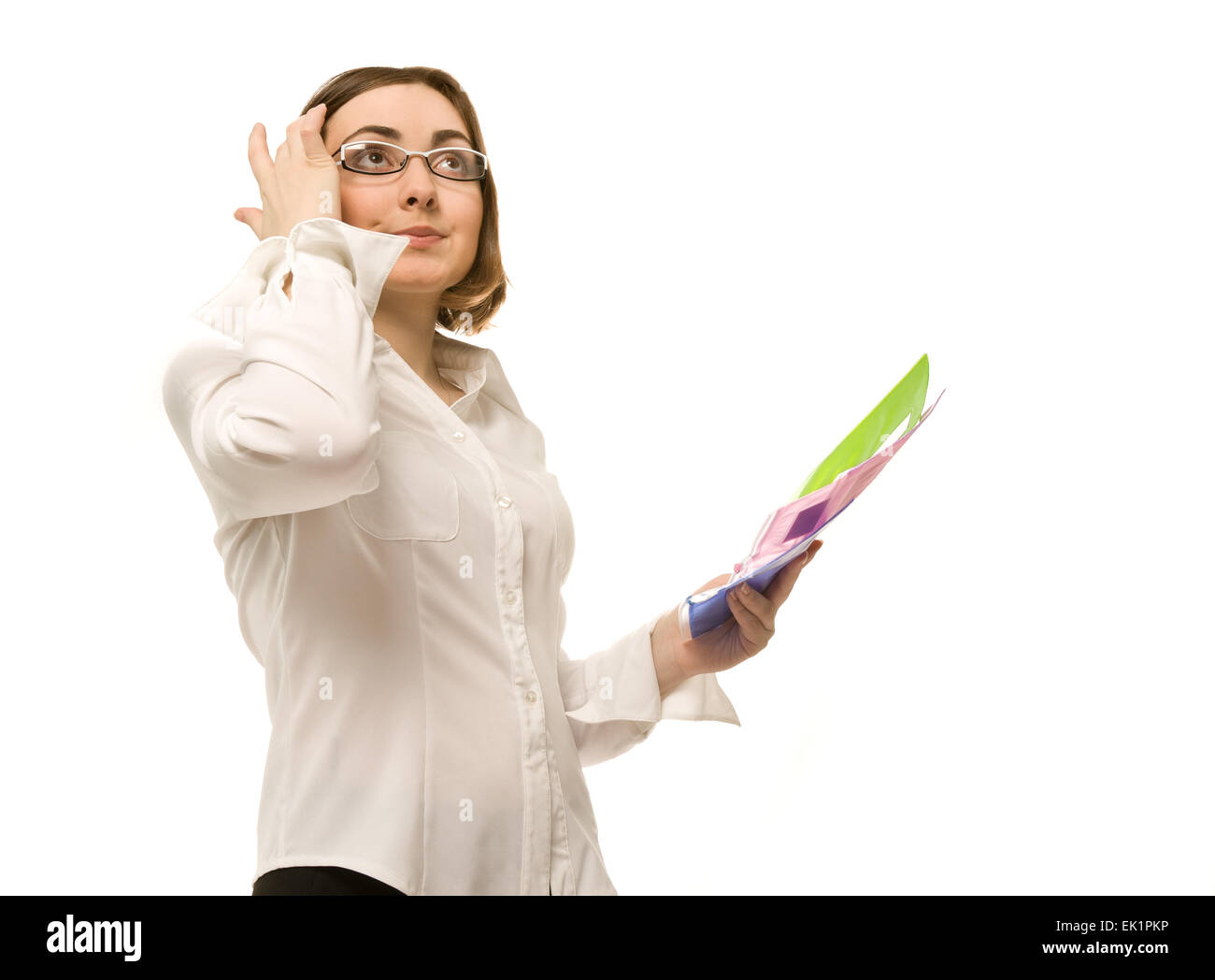 Picture of businesswoman holding colorful folders and looking up Stock ...