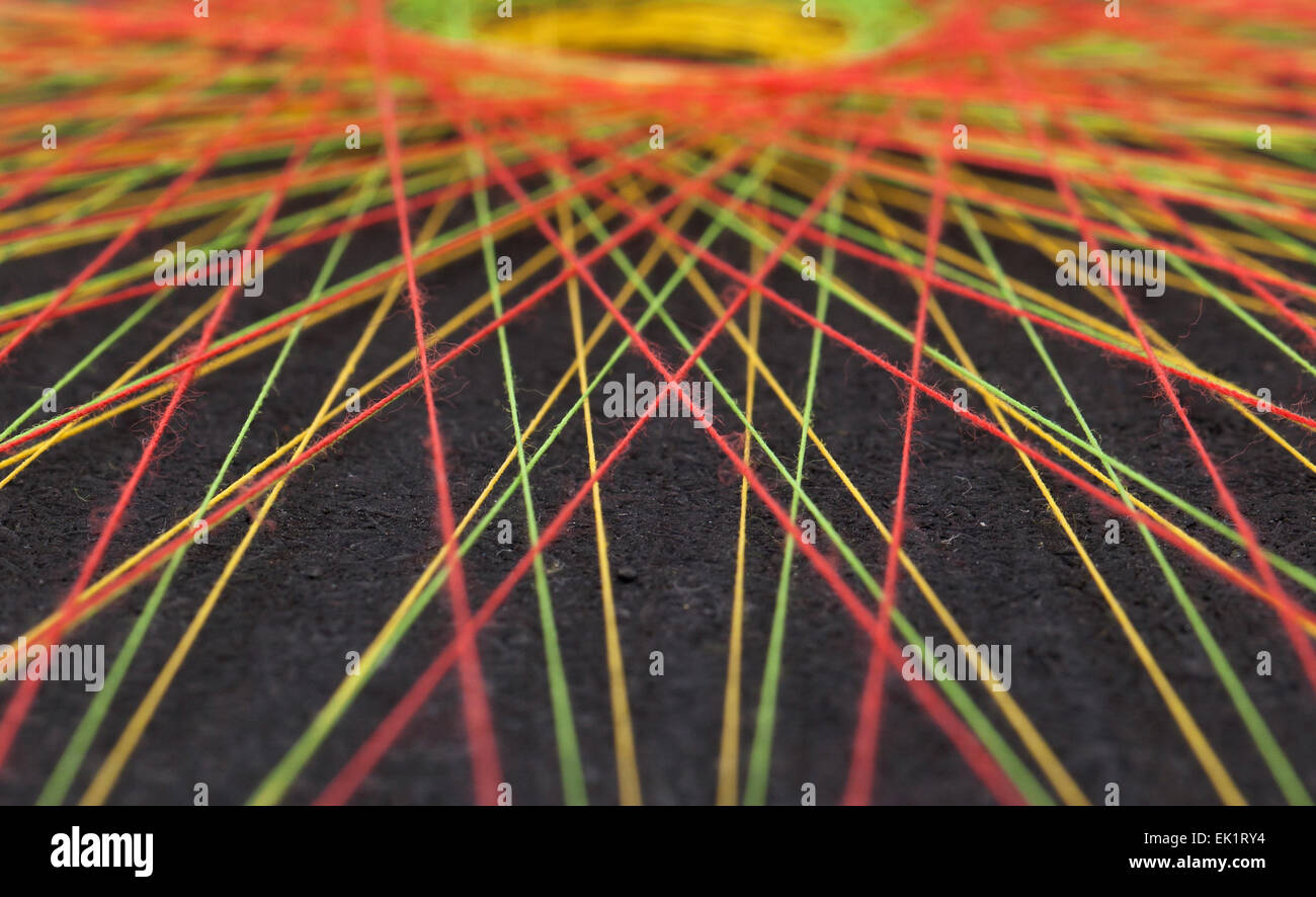 Display of colorful threads on a black panel Stock Photo - Alamy