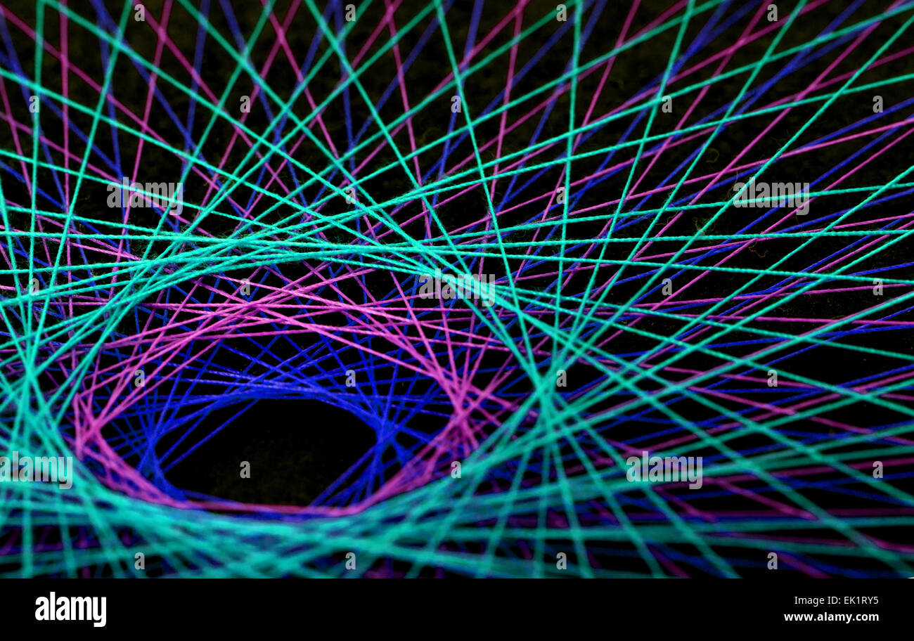 Display of colorful threads on a black panel Stock Photo - Alamy