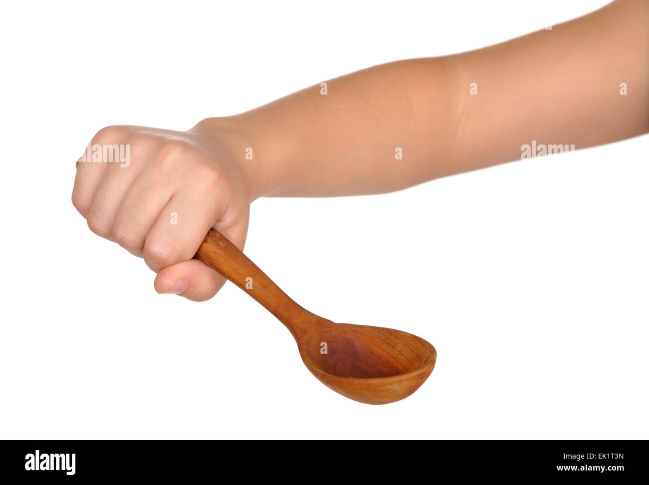 Wooden spoon in baby hand over white background Stock Photo - Alamy