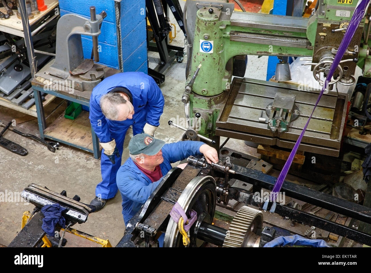 Two engineers working on an electro-mechanical tram bogie frame Stock ...