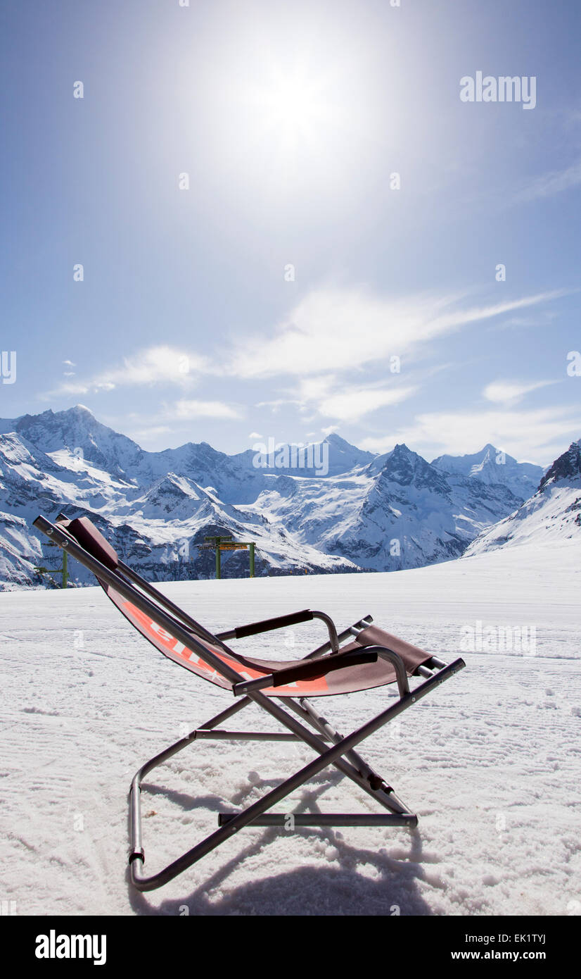 A Chair in the Sun in the Swiss Alps Stock Photo - Alamy