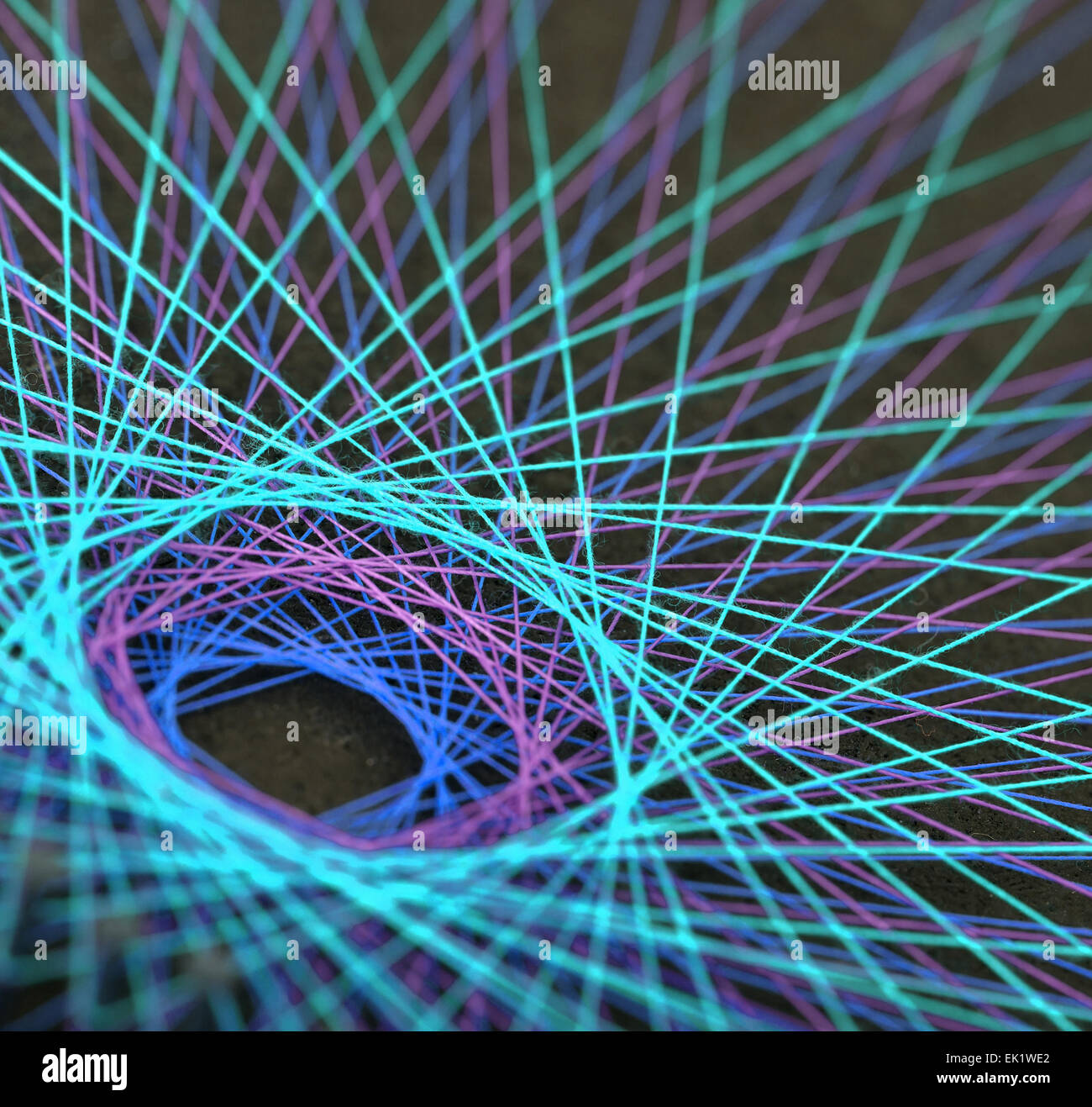 Display of colorful threads on a black panel Stock Photo - Alamy