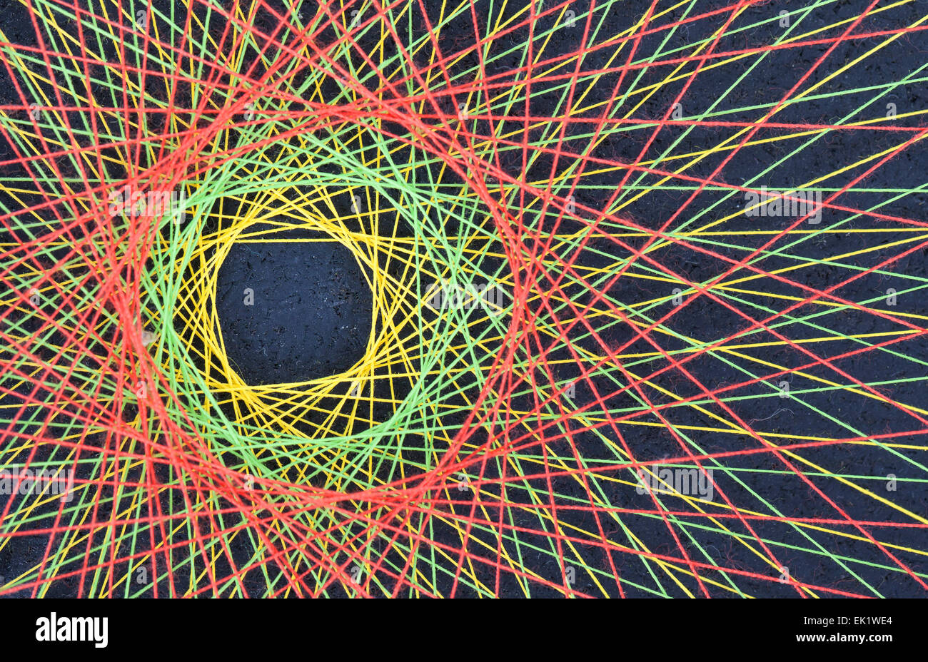 Display of colorful threads on a black panel Stock Photo - Alamy