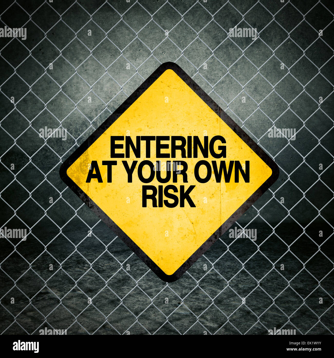 Entering at Your Own Risk Grunge Yellow Warning Sign on Chainlink Fence ...