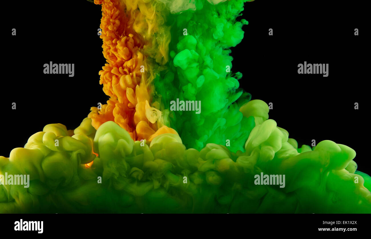 colorful ink creating smoke patterns in water Stock Photo - Alamy