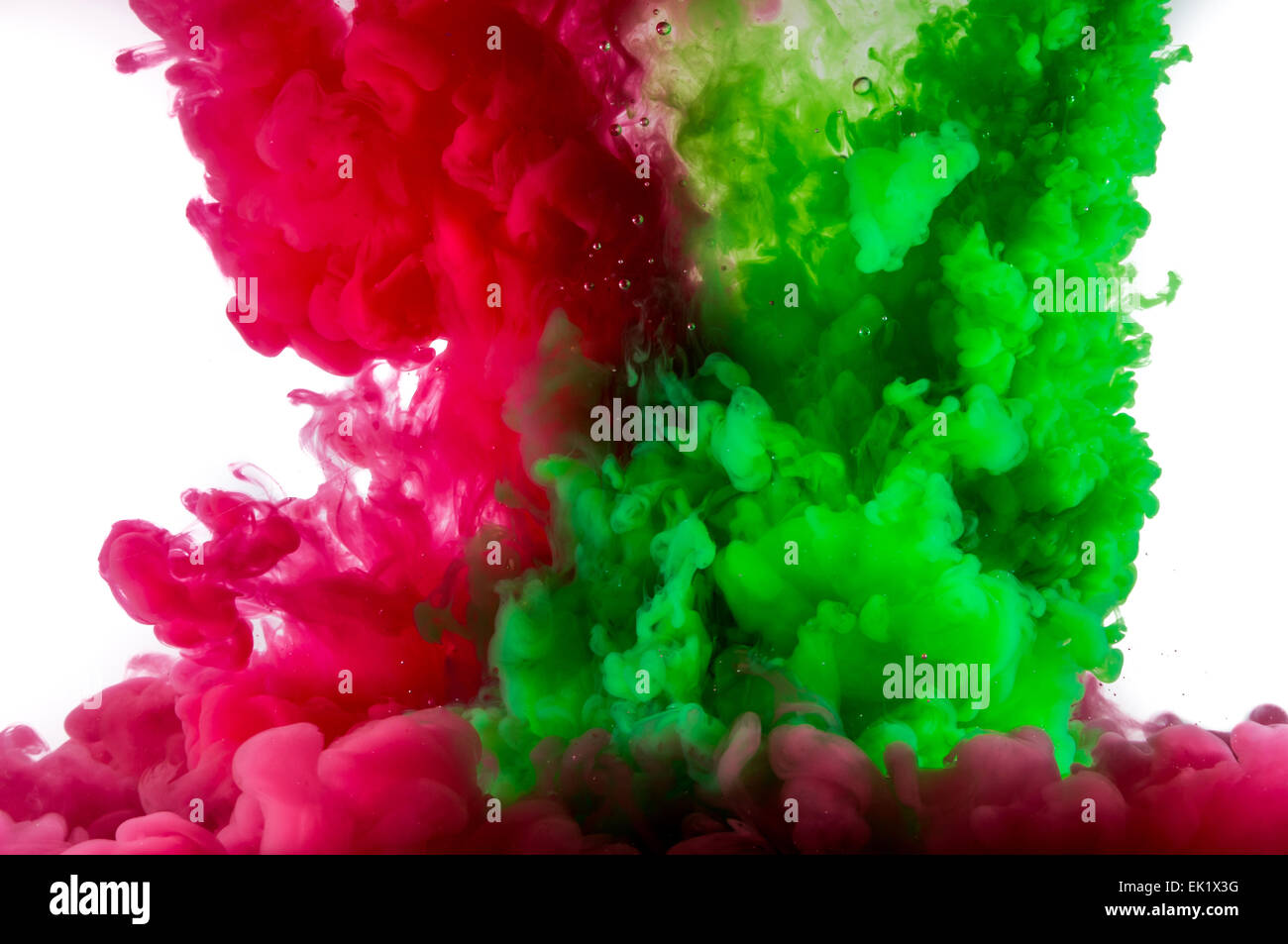 Colorful ink making abstract smoke patterns in water Stock Photo - Alamy